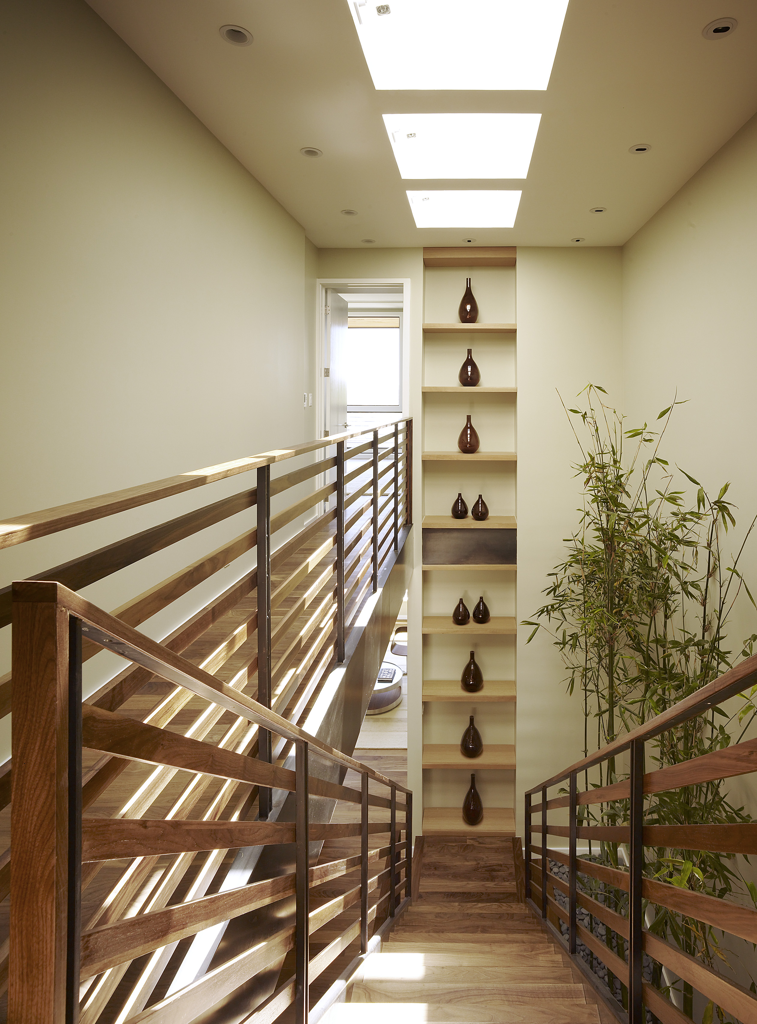 An open-plan space with deep storage-case room dividers, in lieu of a ...